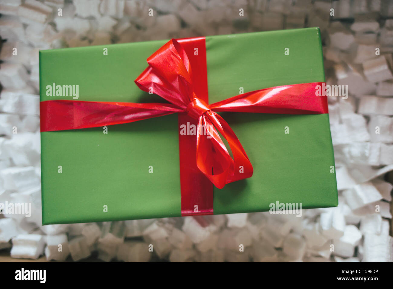 Parcel with gift box inside. Open parcel with present inside Stock ...