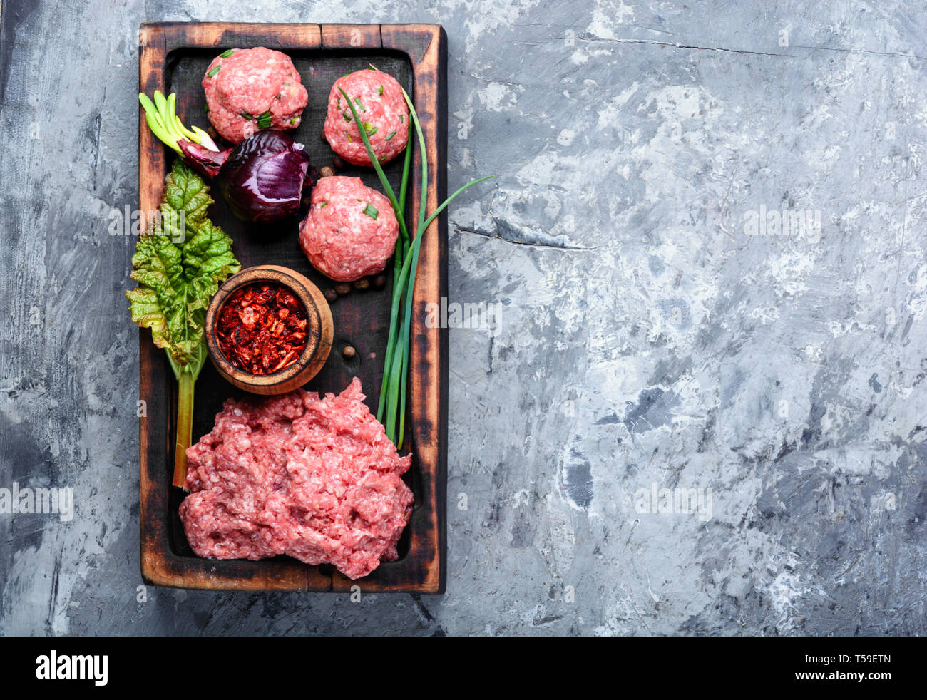Meat balls from raw beef force-meat on a chopping board Stock Photo - Alamy