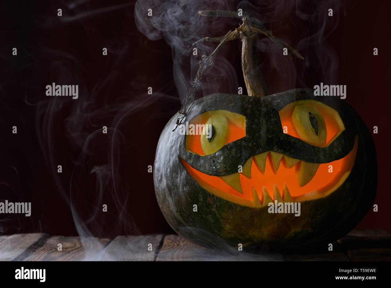 Halloween pumpkin smoke horror eyes hi-res stock photography and images ...