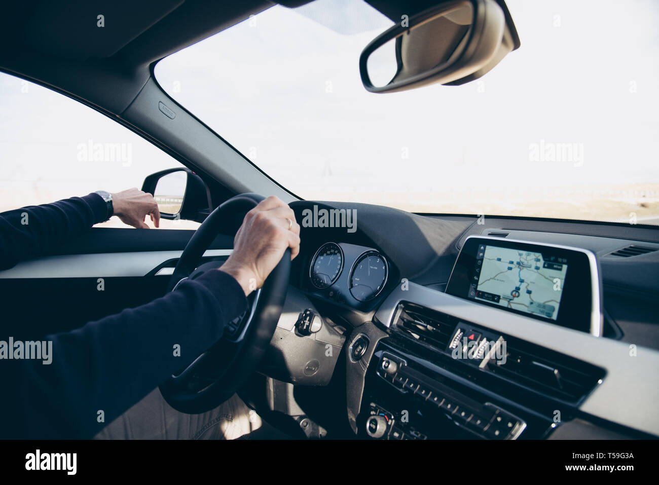 Madrid, Spain - April 1, 2019: Side view of man driving BMW X2 car ...