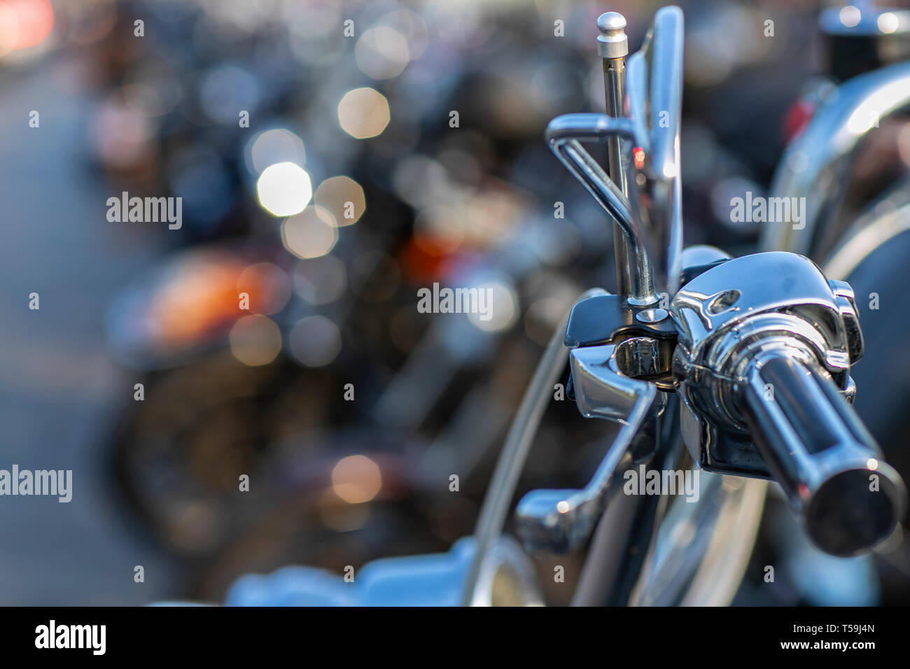 The chromed handlebar of a motorcycle. View of motorcycle handlebar in ...