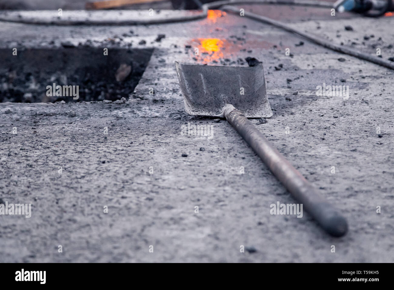 Closeup of professional tools for asphalt repair, road pit, shovel ...
