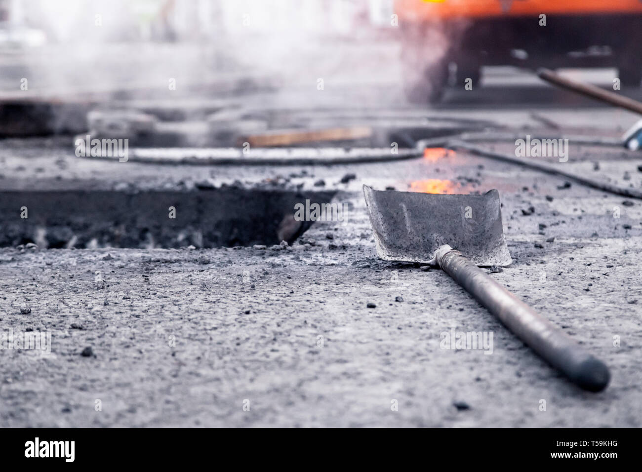 Closeup of professional tools for asphalt repair, road pit, shovel ...