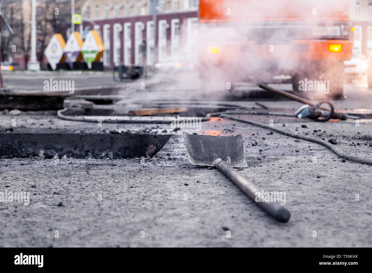 Closeup of professional tools for asphalt repair, road pit, shovel ...