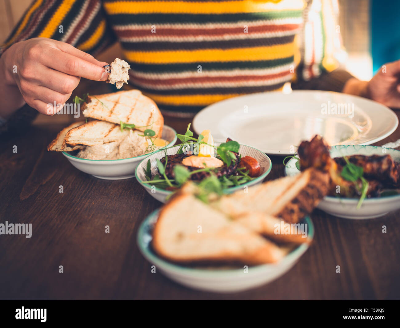 Woman eating tapas hi-res stock photography and images - Alamy