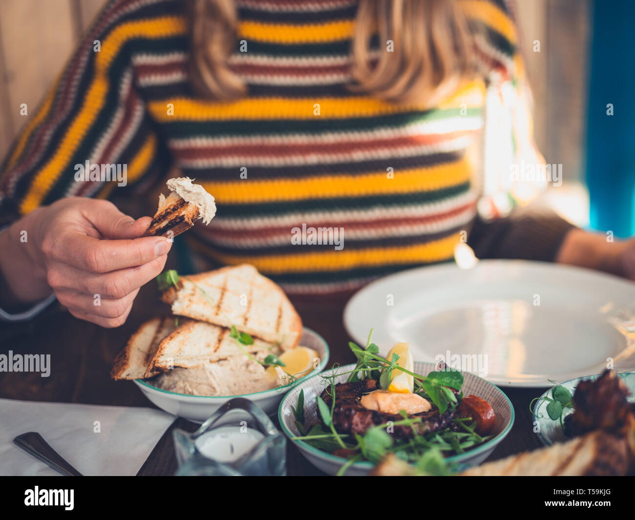Woman eating tapas hi-res stock photography and images - Alamy