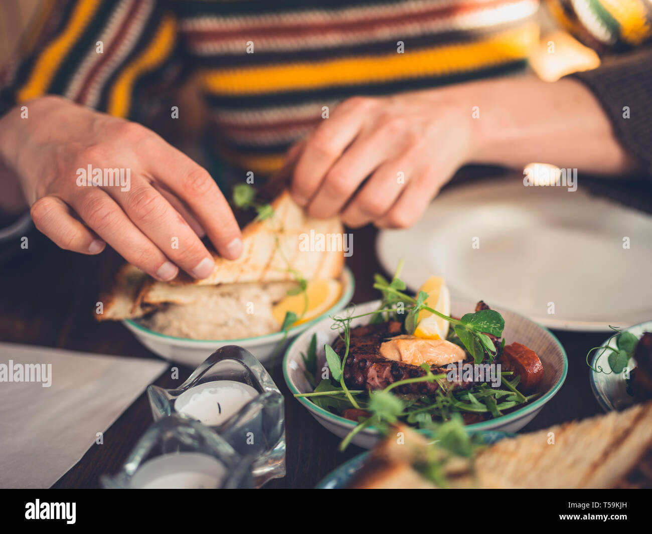 Woman eating tapas hi-res stock photography and images - Alamy