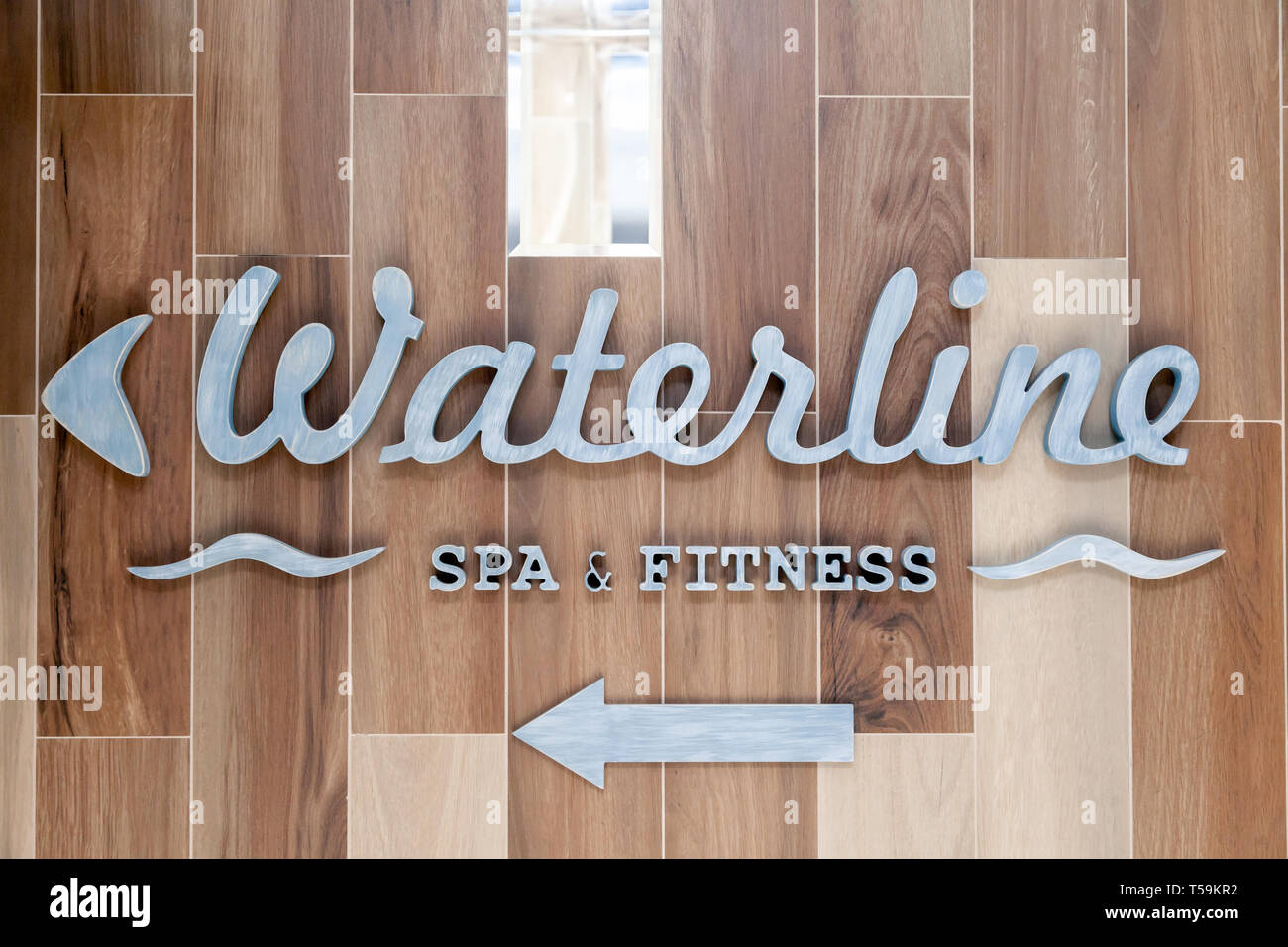 Silver letters, pointer of waterline, spa, fitness sign on the wall ...