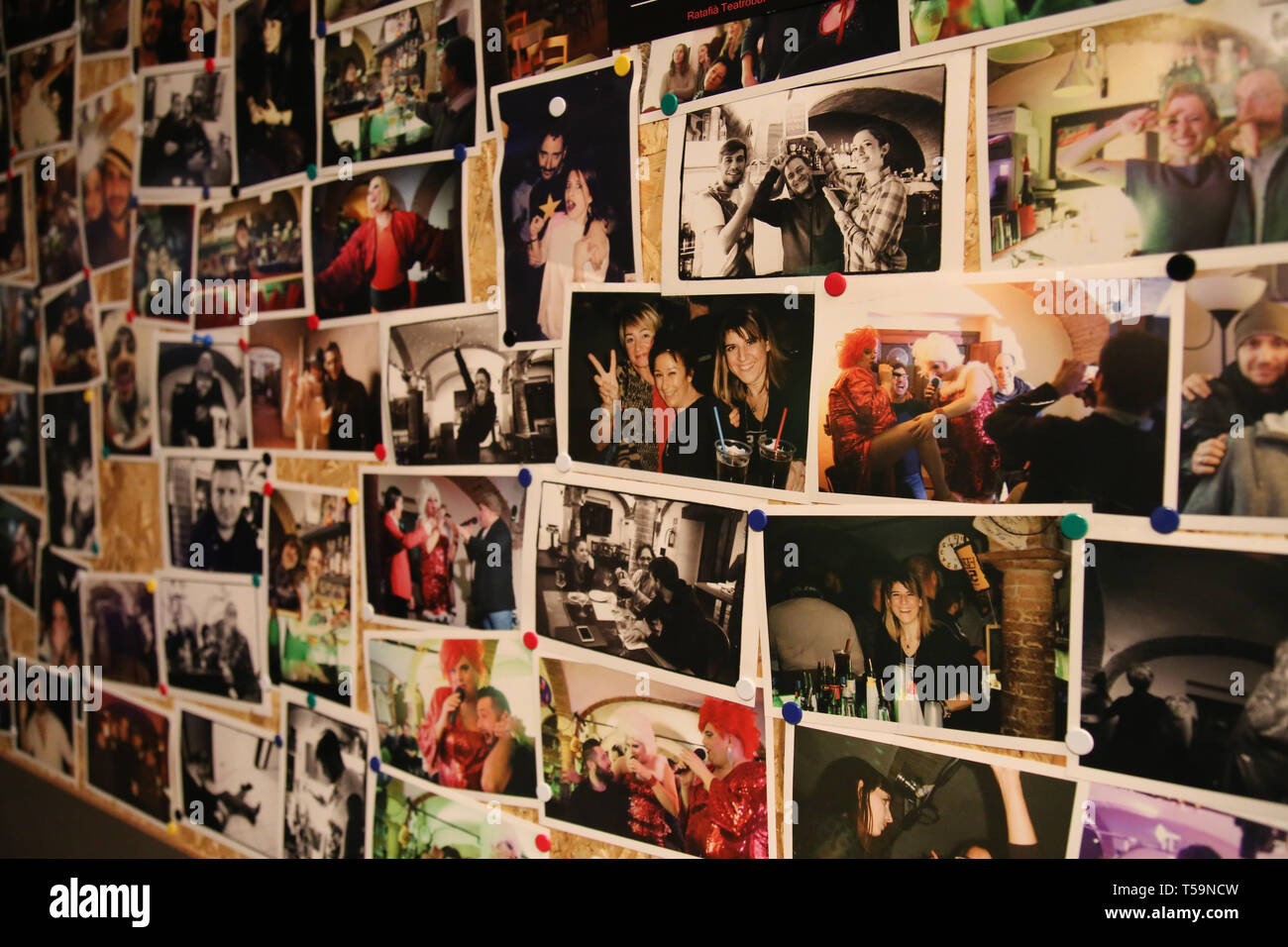 Photographs of various people on the wall Stock Photo - Alamy