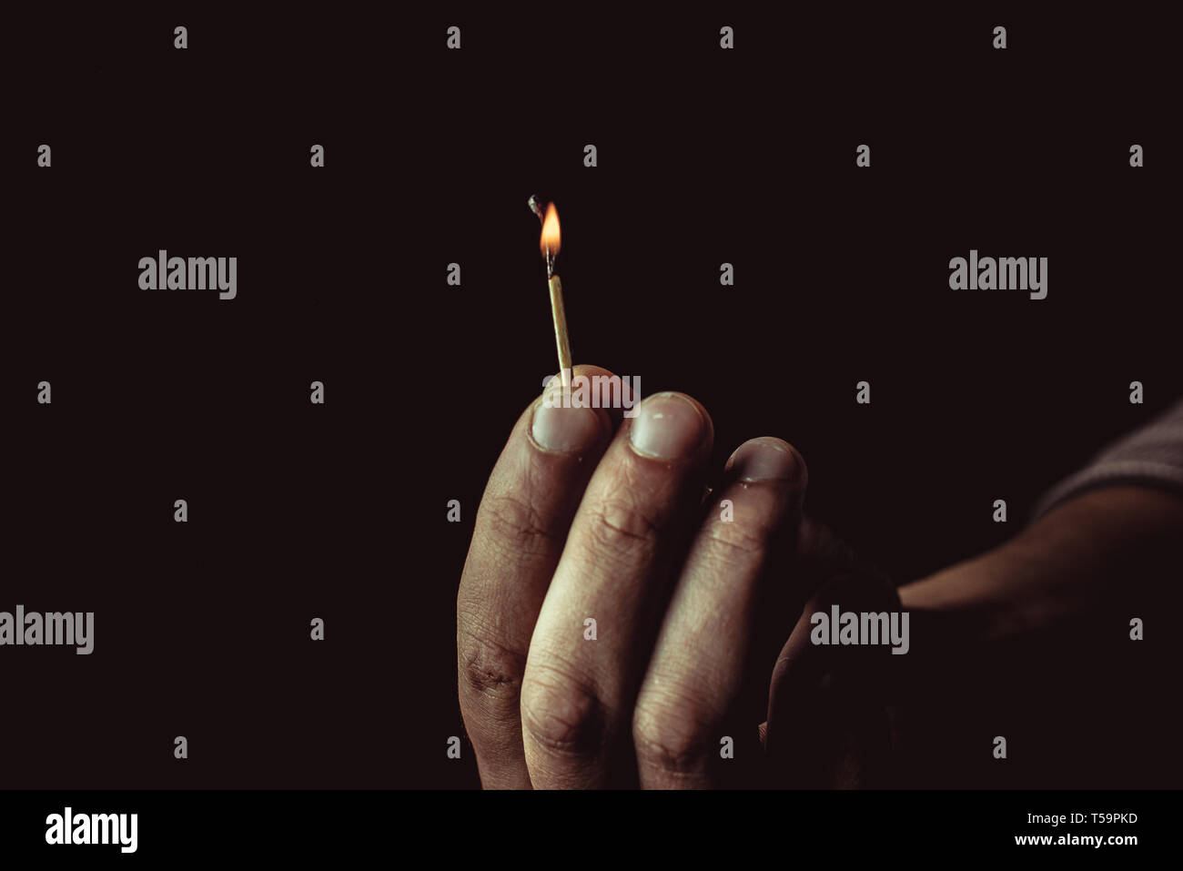 Burning matchstick in the dark night hi-res stock photography and ...
