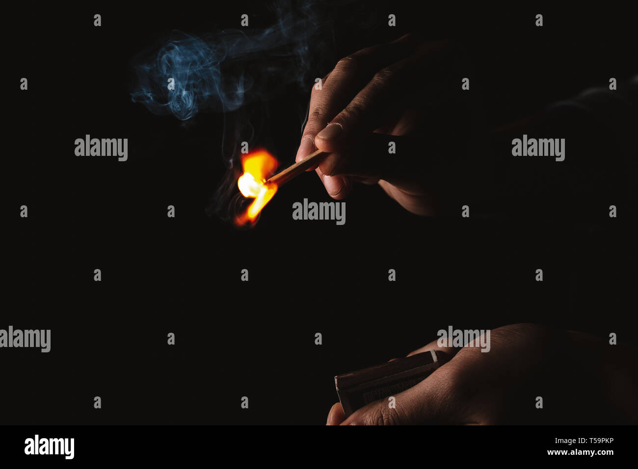 Burning matchstick in the dark night hi-res stock photography and ...