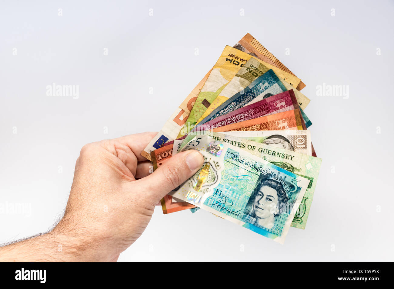 Hand holding banknotes hi-res stock photography and images - Alamy