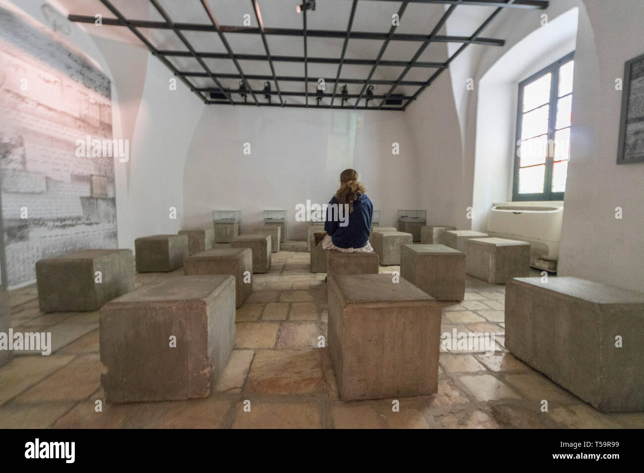 Jerusael, Israel. A girl in the movie room of the Museum of the Jewish ...