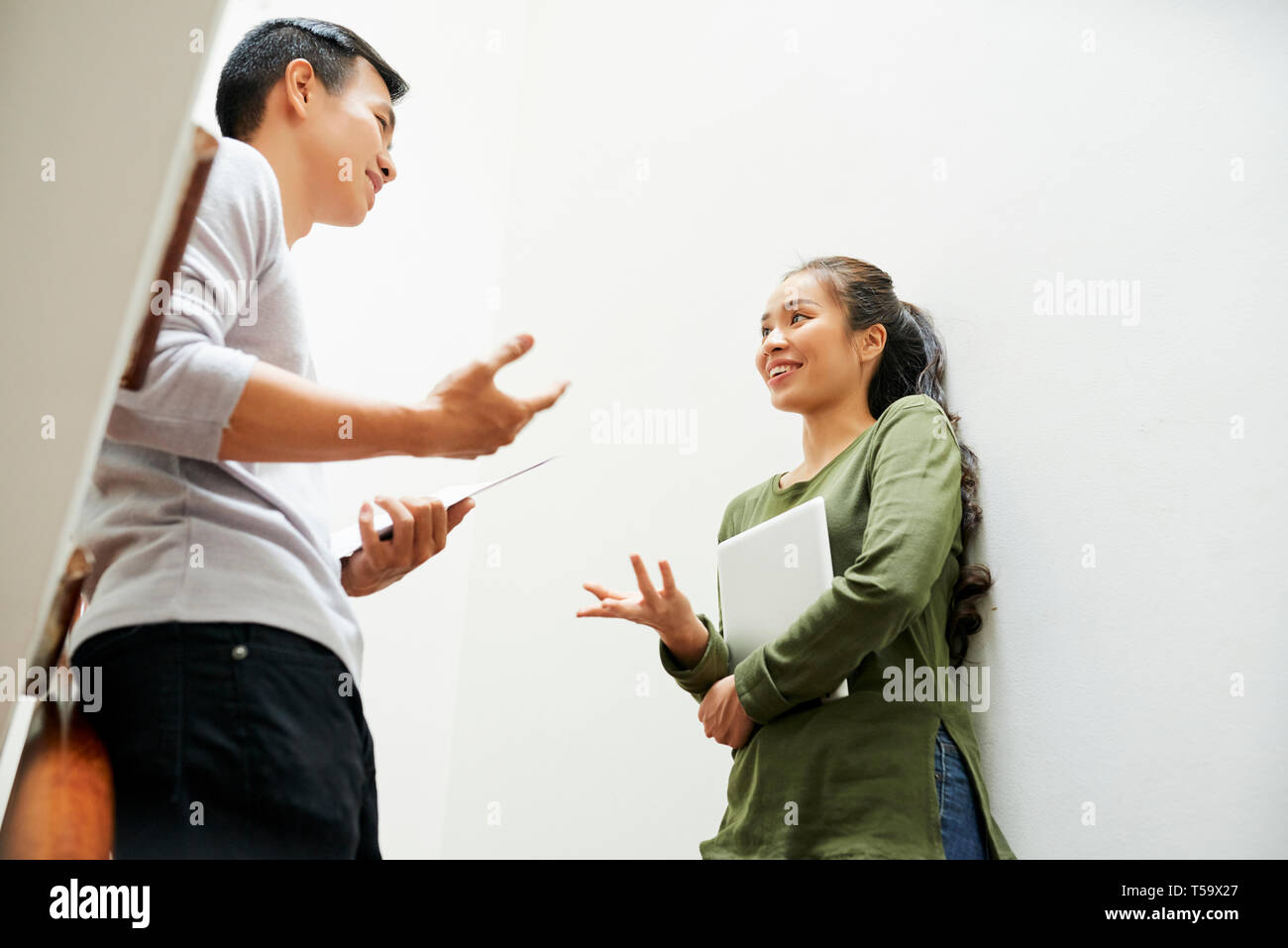 Young people exchanging ideas Stock Photo - Alamy