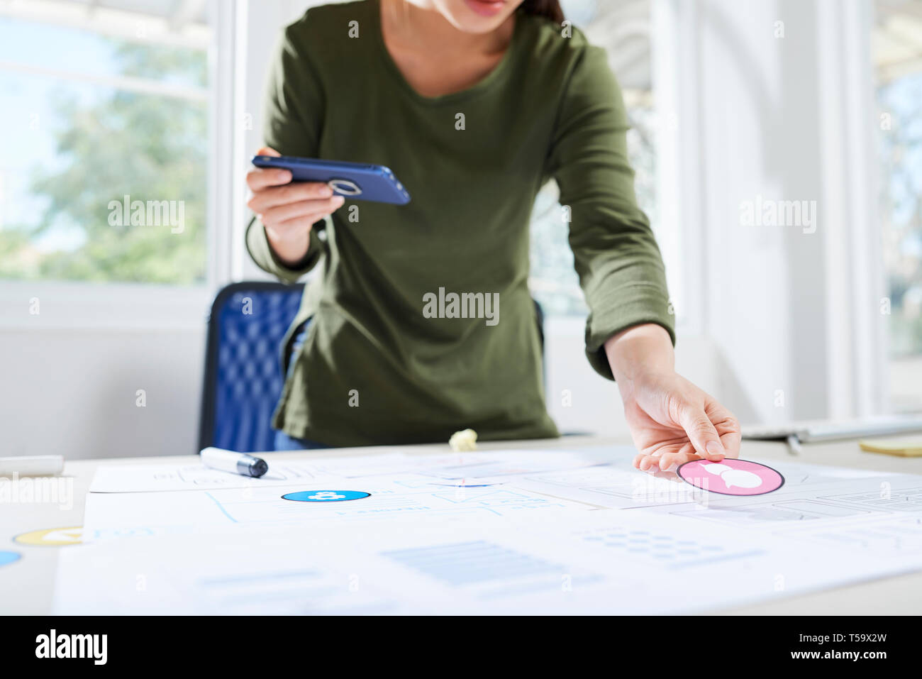 Putting sticker to sketch Stock Photo - Alamy