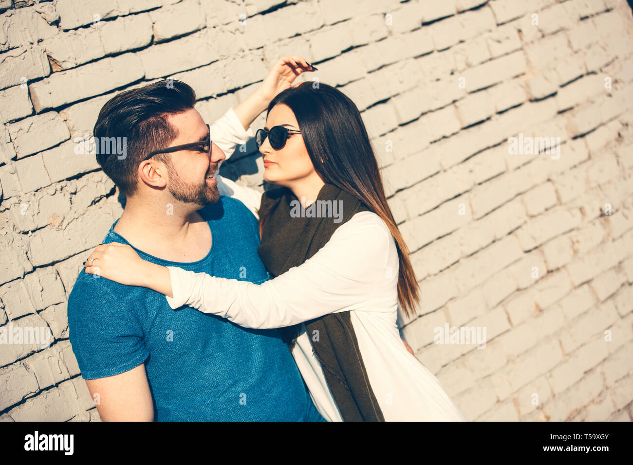 Posing female against brick wall hi-res stock photography and images ...