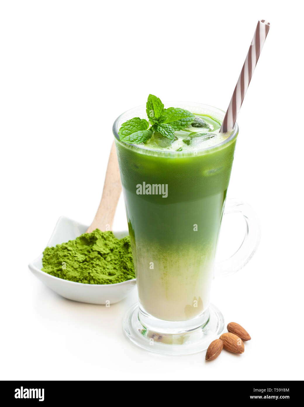 Homemade layered iced matcha latte tea with almond milk isolated on ...