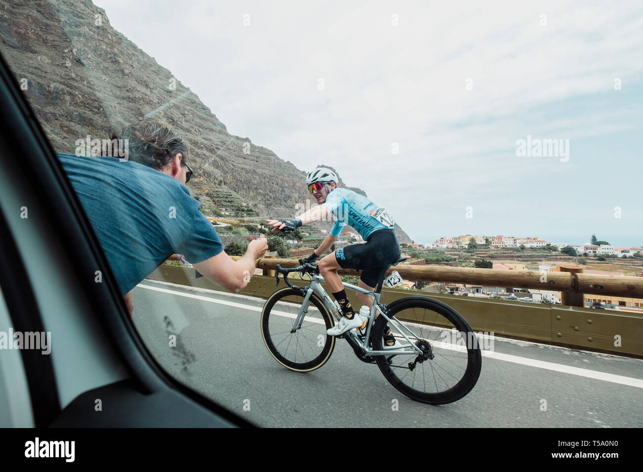 A mechanic helping a cyclist rider in a race Stock Photo - Alamy