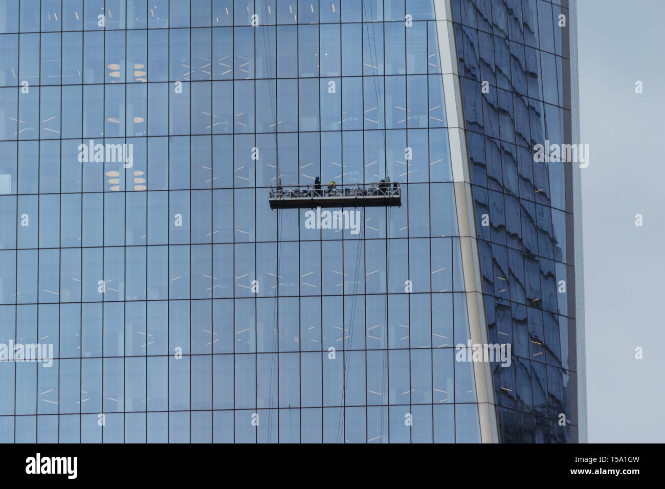 Window washers cleaning the facade of Liberty tower Stock Photo - Alamy