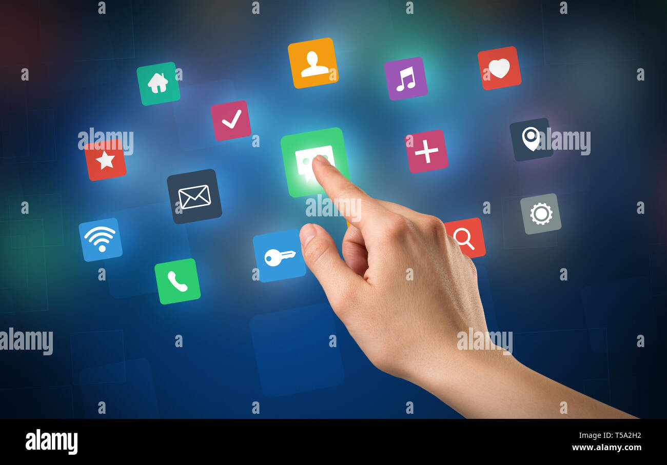 Female hand touching colorful applications Stock Photo - Alamy
