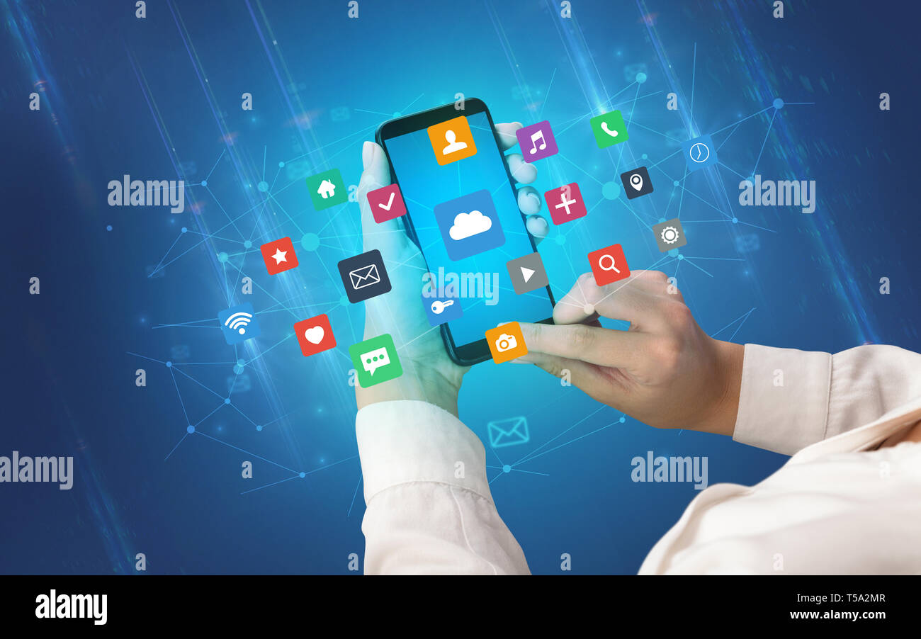 Female hand using smartphone with colorful application icons around ...
