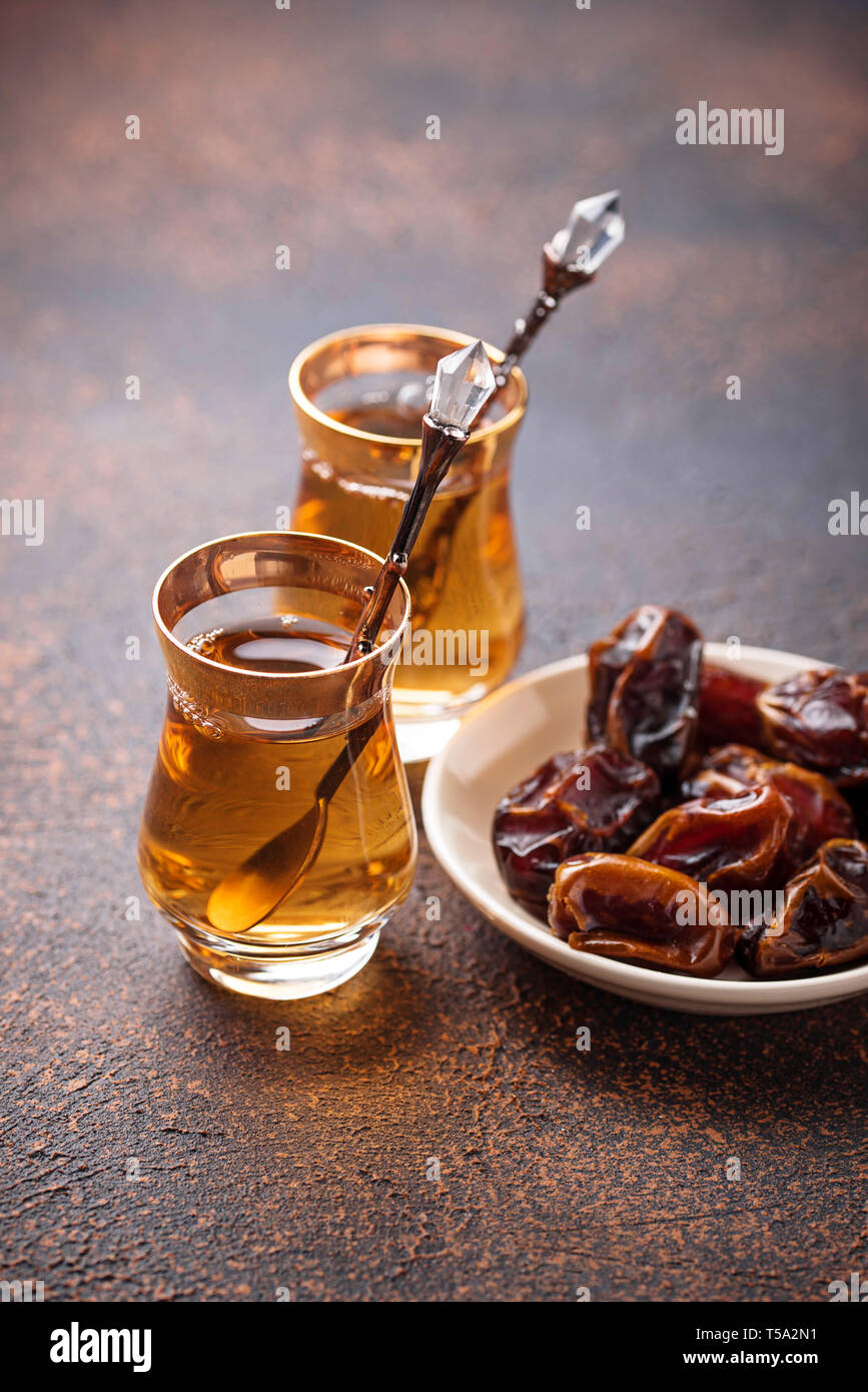 Traditional arabic tea and dry dates Stock Photo - Alamy