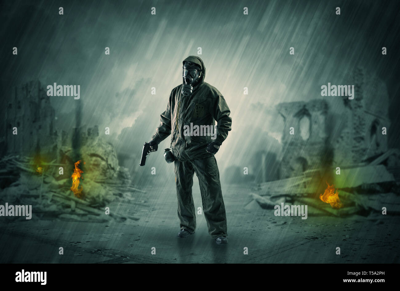 Destroyed place after a catastrophe with man in gas mask and weapon on ...