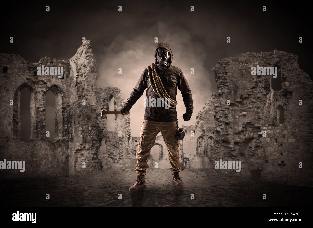 Hazard, menace man in a ruined crumbly building with arms on his hand ...