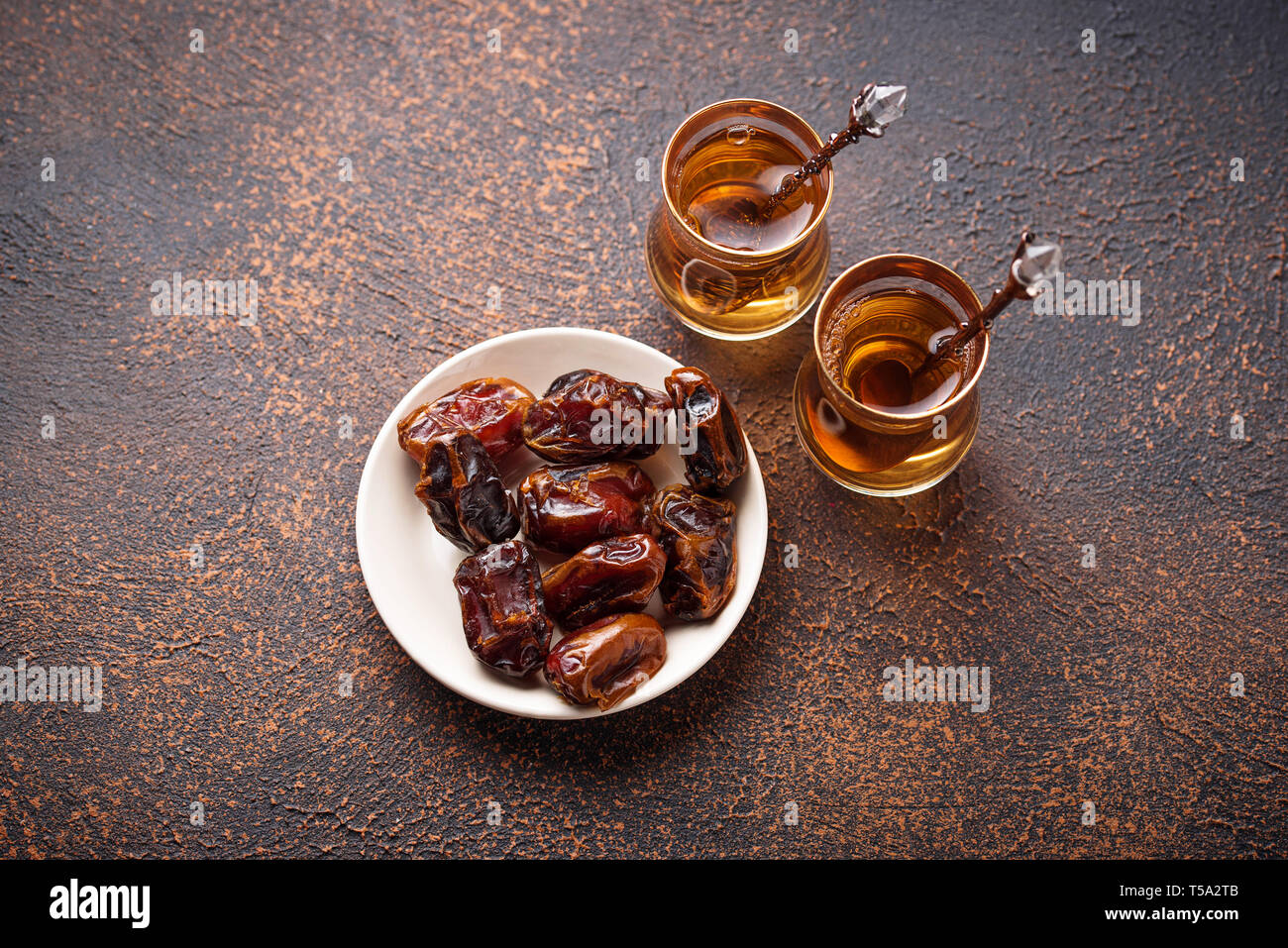 Traditional arabic tea and dry dates Stock Photo - Alamy