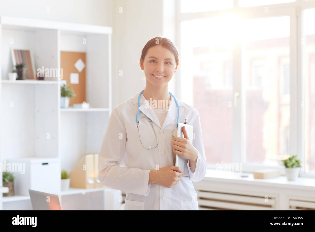 Smiling Female Doctor Stock Photo - Alamy