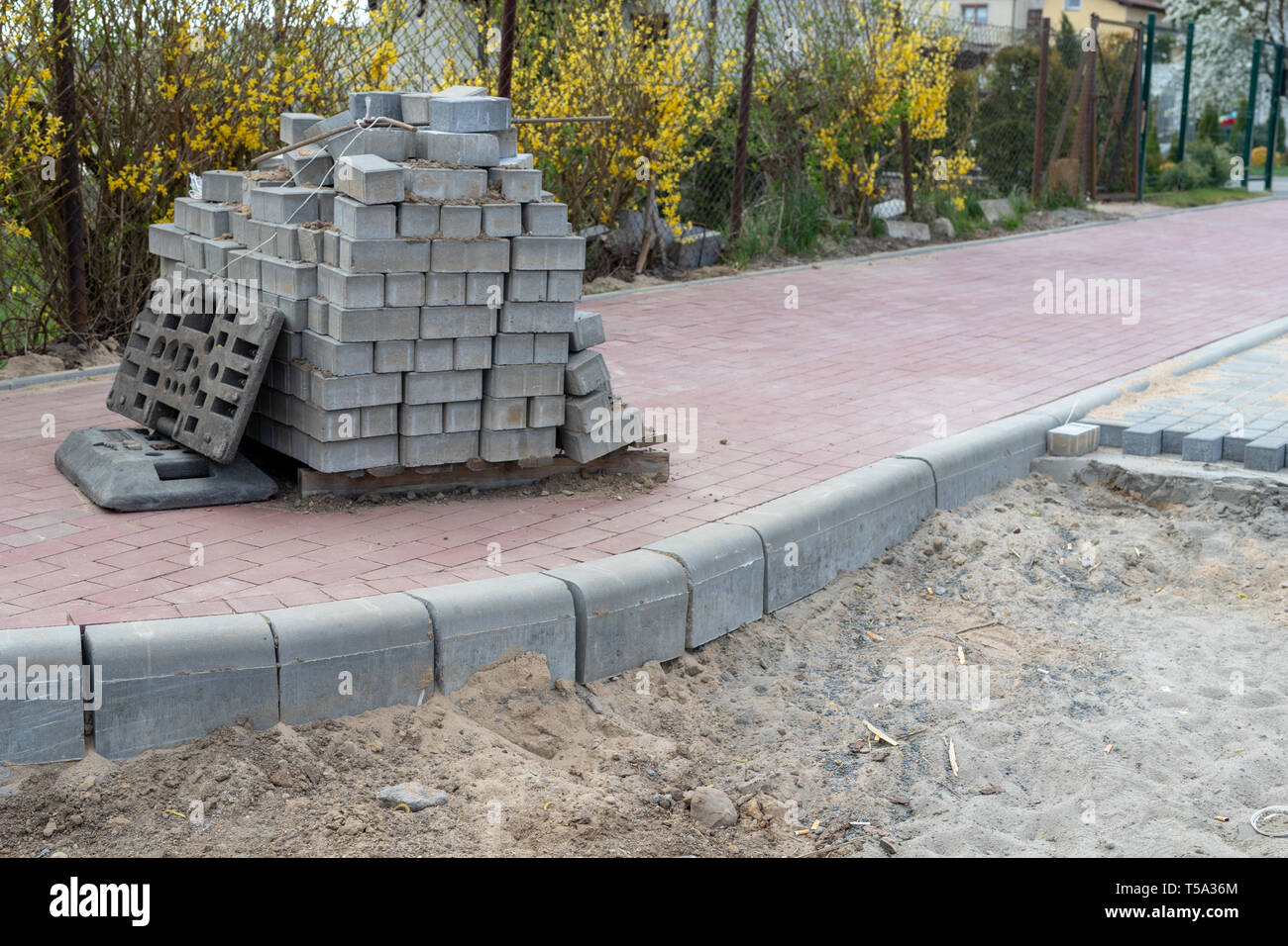 Construction of a new road from concrete blocks. New investments in a ...