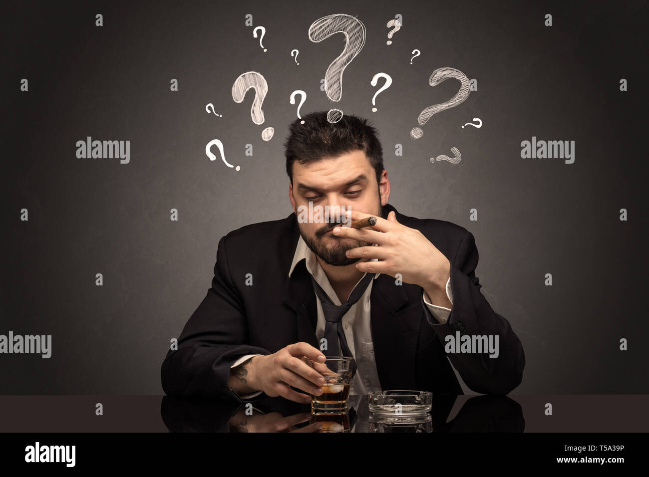 Young drunk disappointed man with question signs concept Stock Photo ...