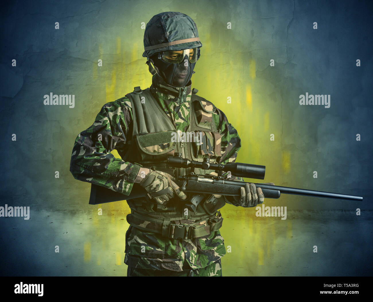 Hazard, menace soldier in a ruined crumbly building with arms on his ...