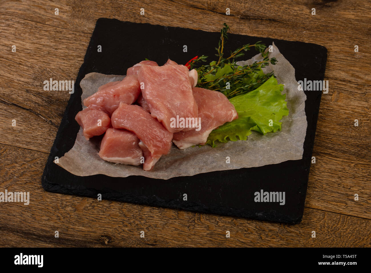 Raw pork meat heap for roast Stock Photo - Alamy