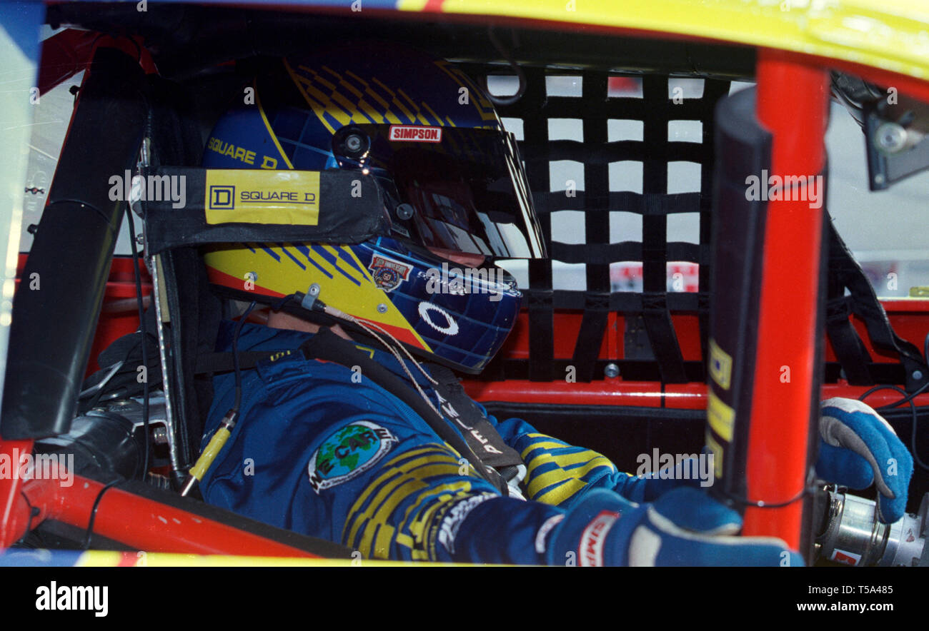 Kenny Wallace sits in his car at the Southern 500 on September 6, 1998 ...