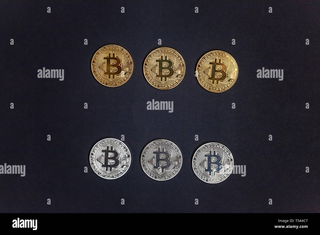 Silver and gold bitcoin on black background. Electronic virtual money ...