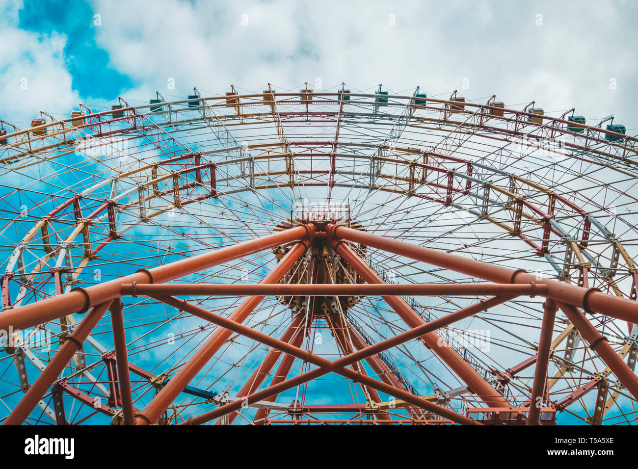 A colourful ferris wheel. Front view. bottom view of the high Ferris ...
