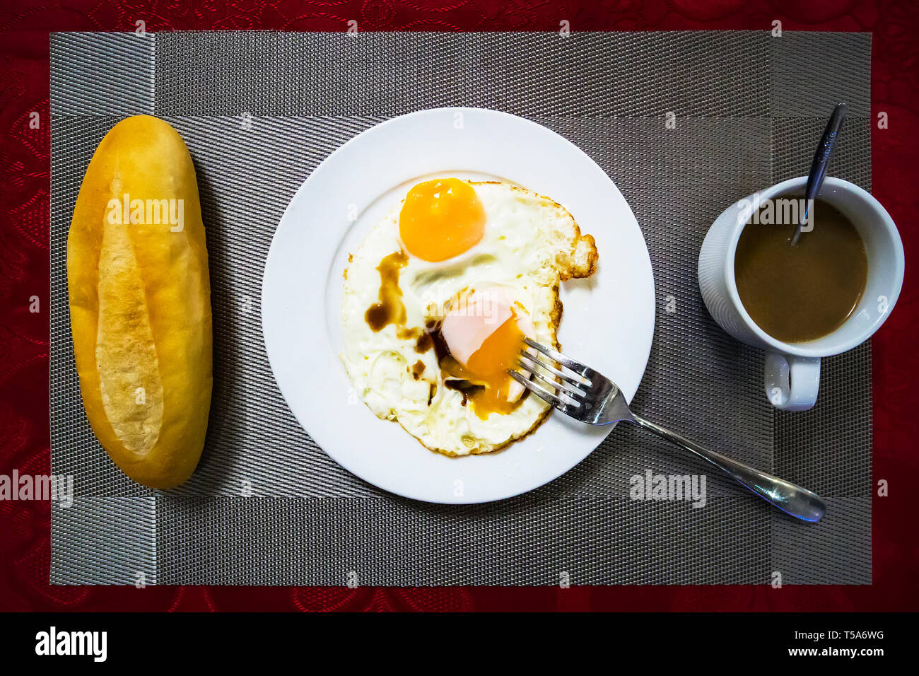 Flat lay, top view fresh bread with wheat, cereal and egg, milk, cofee ...