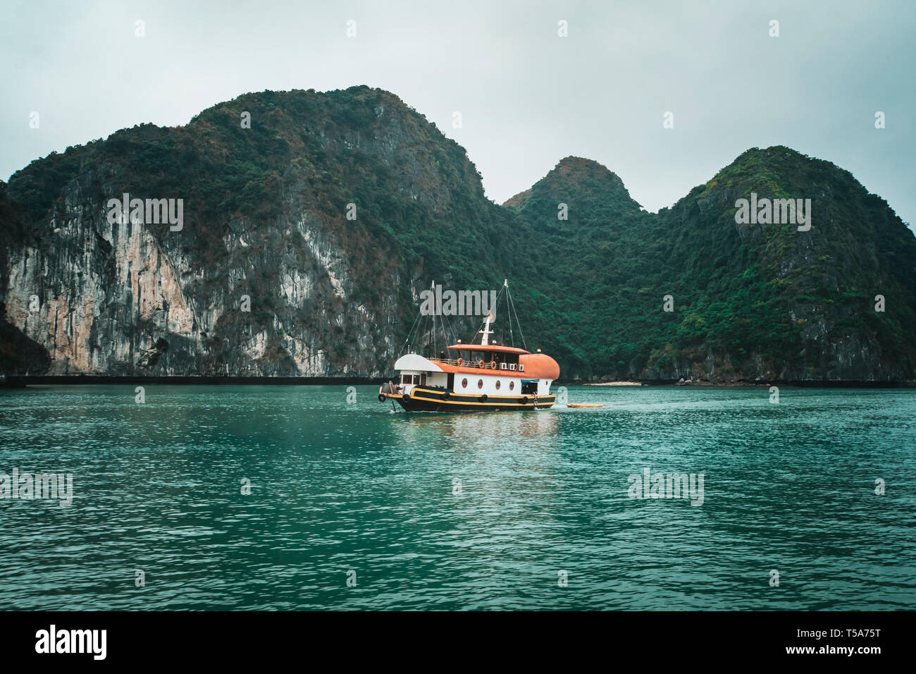 cruising among beautiful limestone rocks and secluded beaches in Ha ...