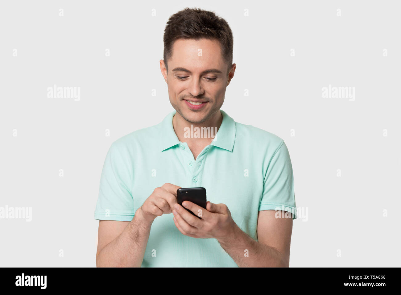 Smiling caucasian man using hi-res stock photography and images - Alamy