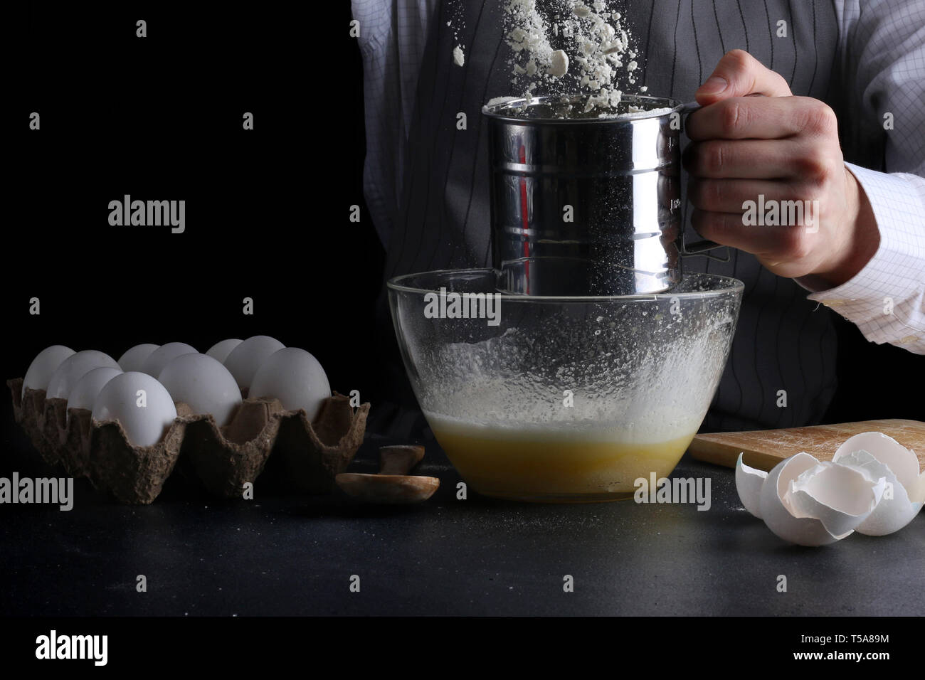 Man hands pouring flour in hi-res stock photography and images - Alamy