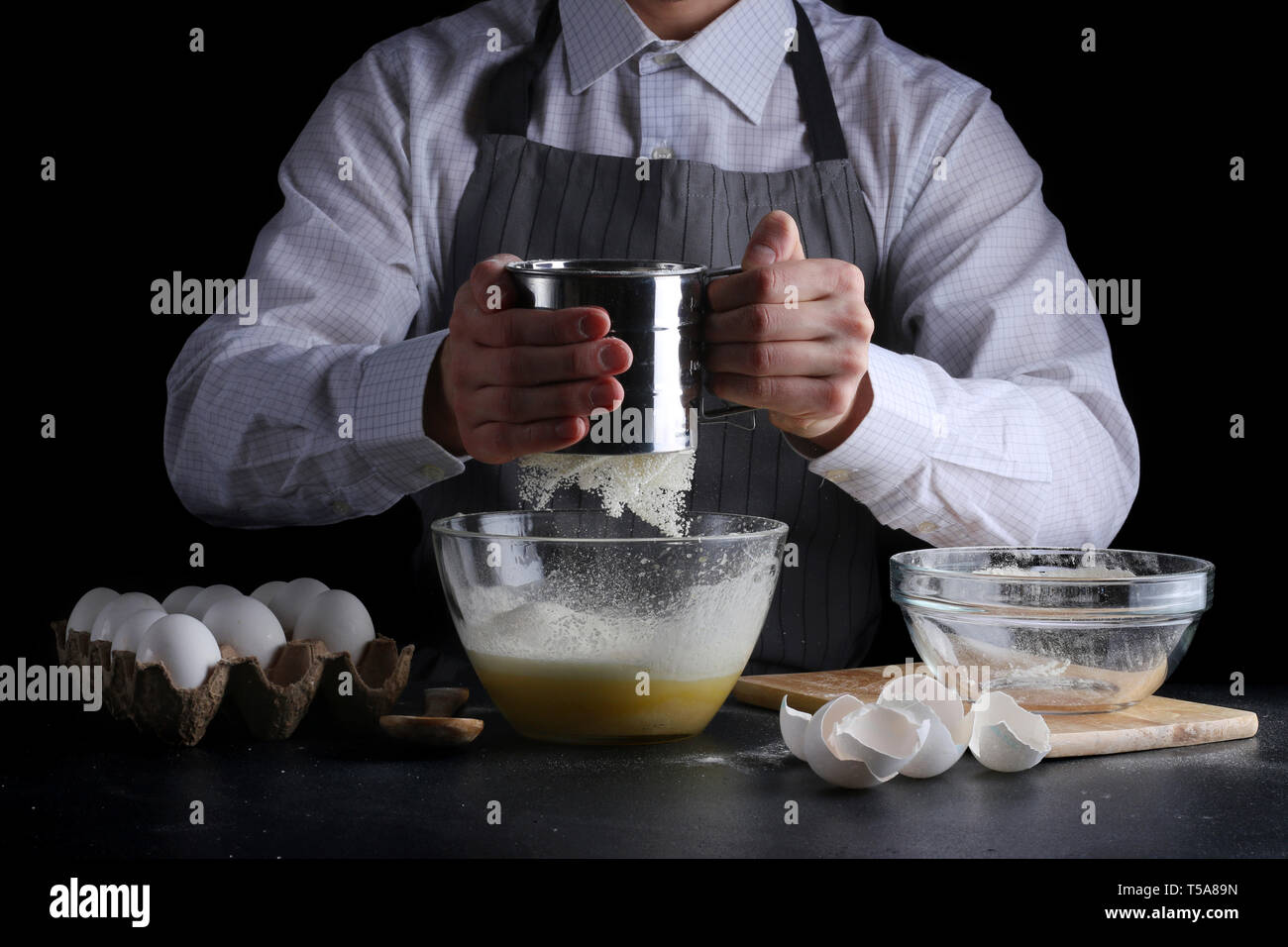 Man hands pouring flour in hi-res stock photography and images - Alamy