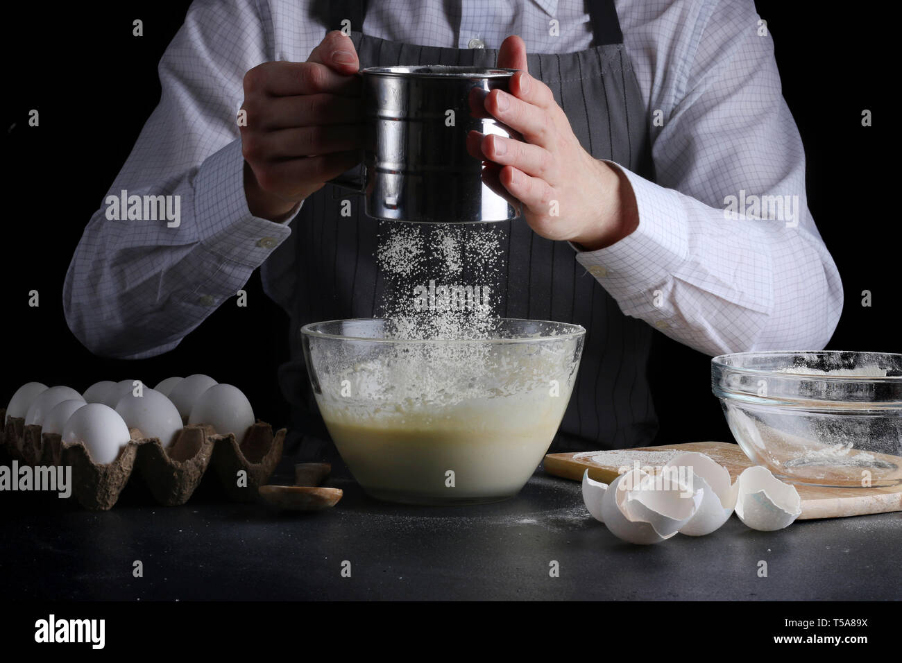 Man hands pouring flour in hi-res stock photography and images - Alamy