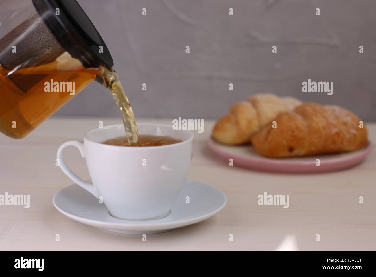 Tea pouring into cup hi-res stock photography and images - Alamy