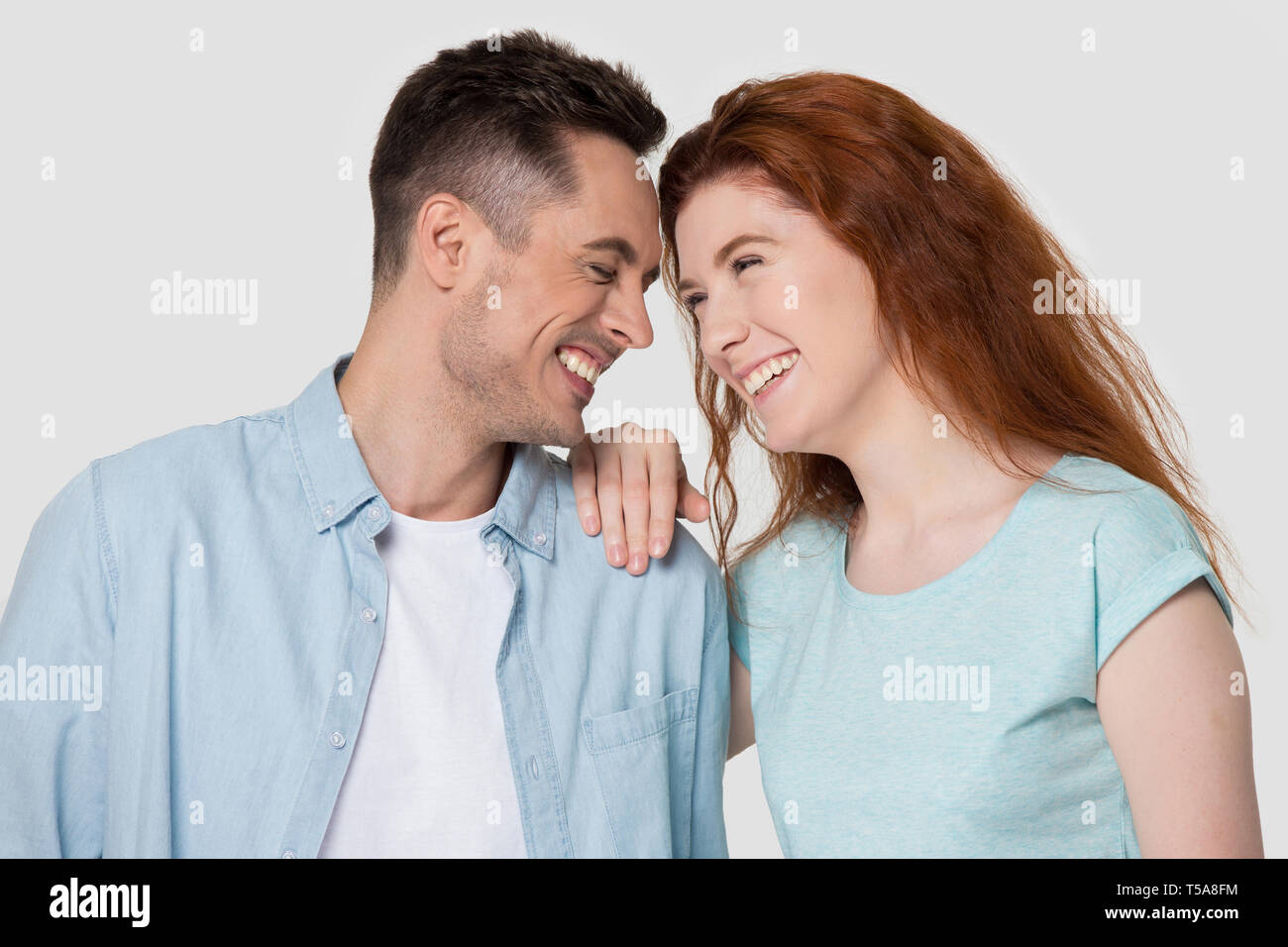 Happy young couple touch foreheads having fun together Stock Photo - Alamy