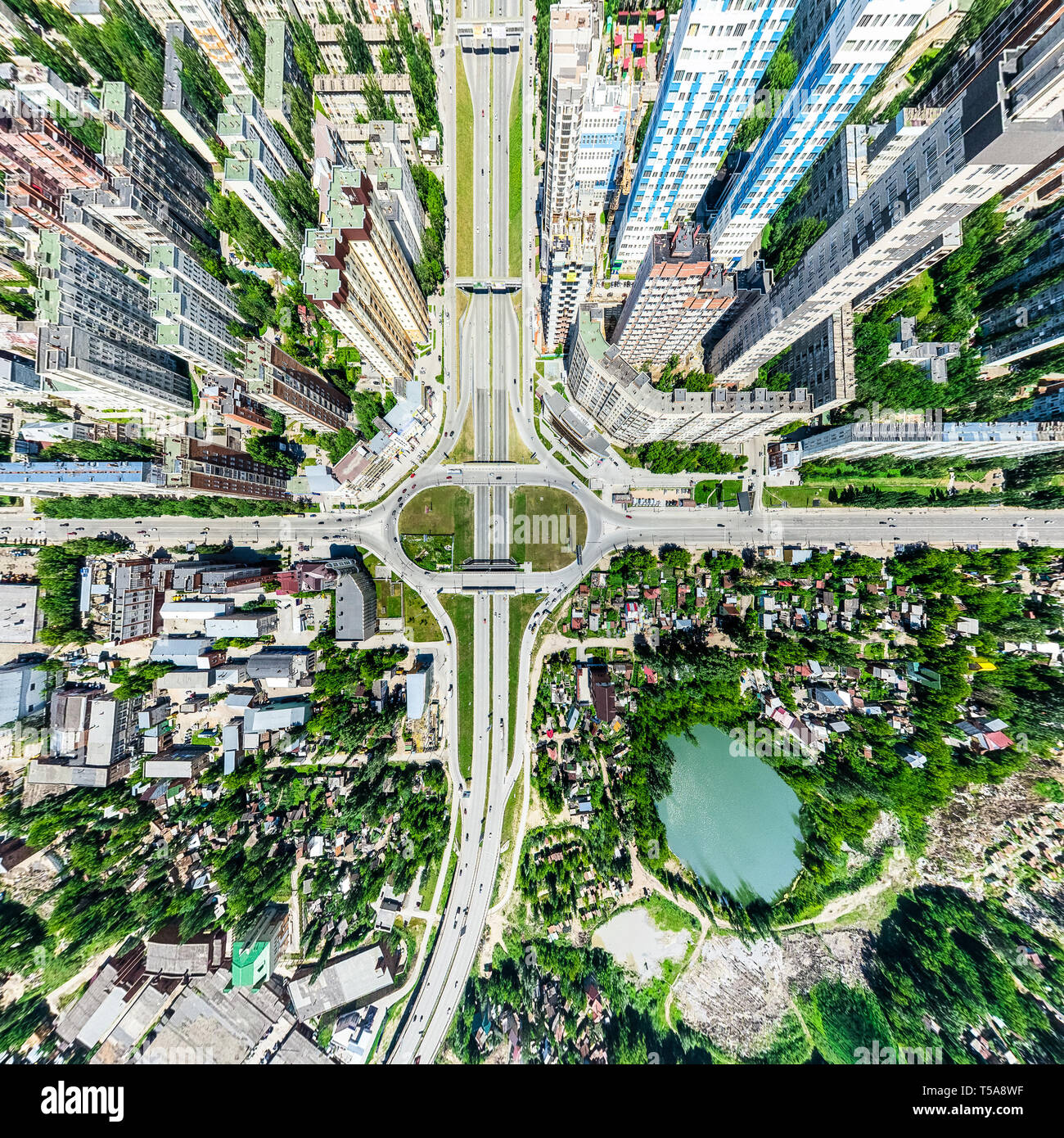 Aerial city view with crossroads and roads, houses, buildings, parks ...