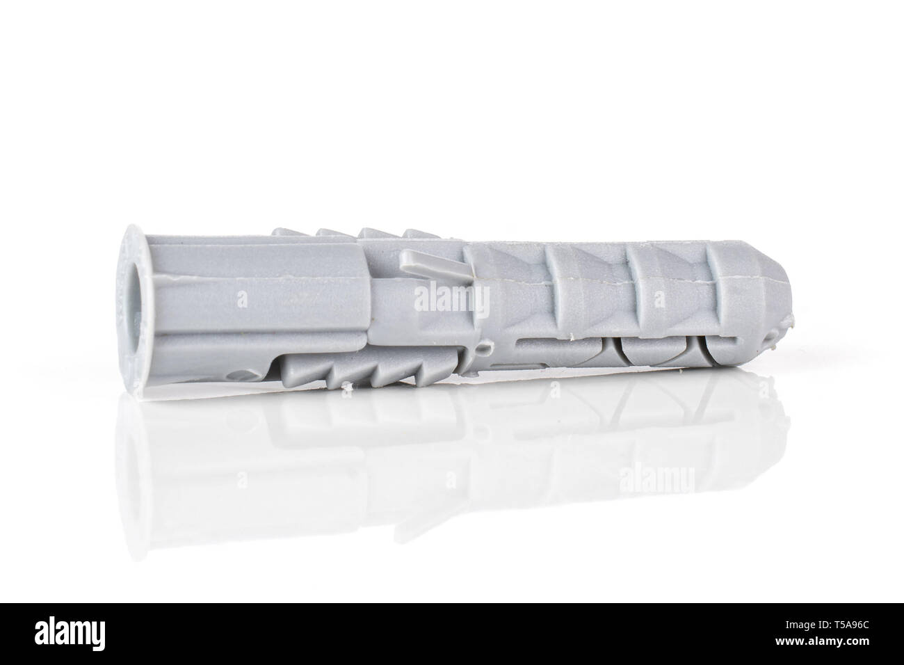 One whole plastic light grey wall plug work item isolated on white ...