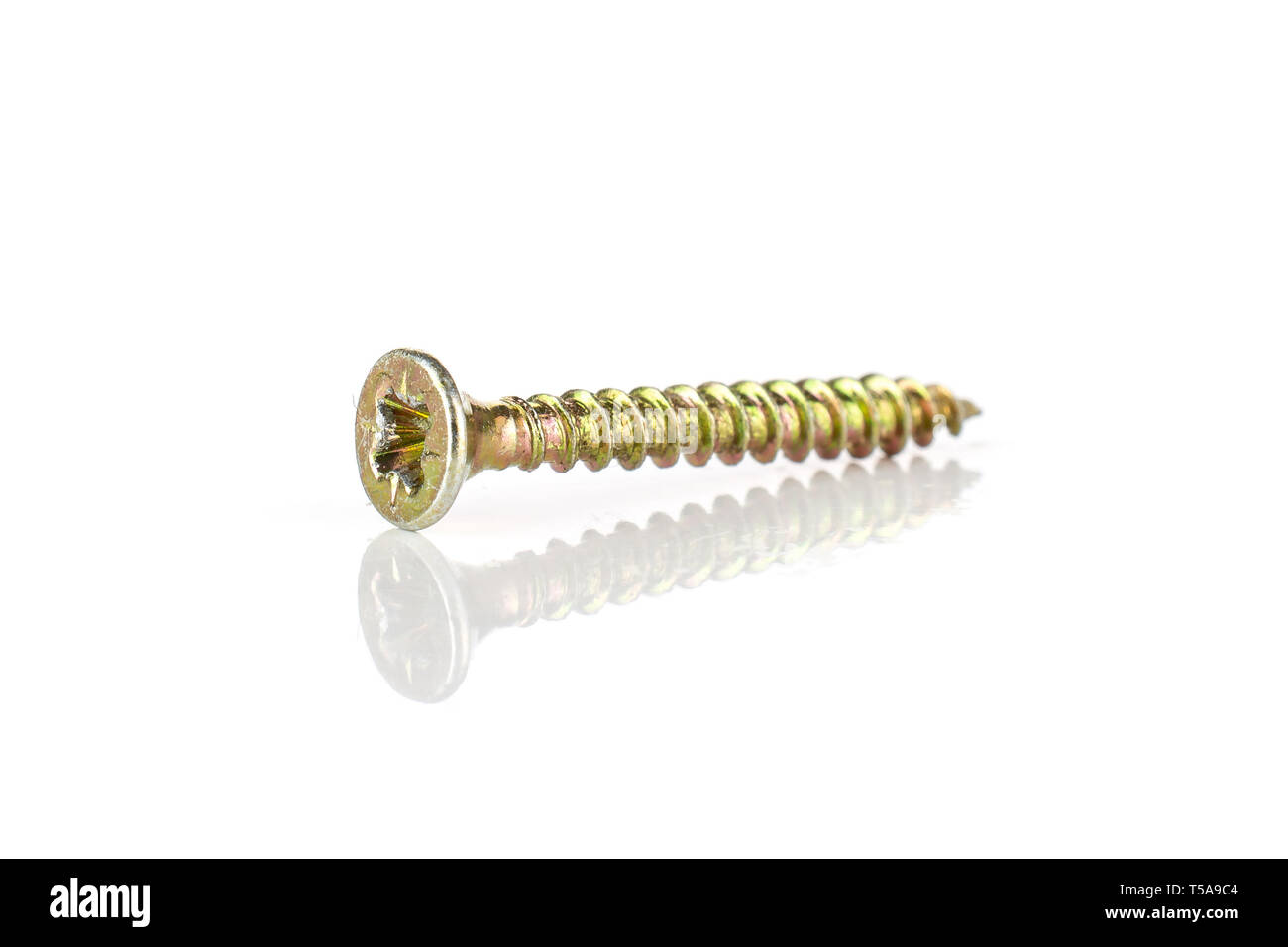 One whole metal golden screw work item isolated on white background ...