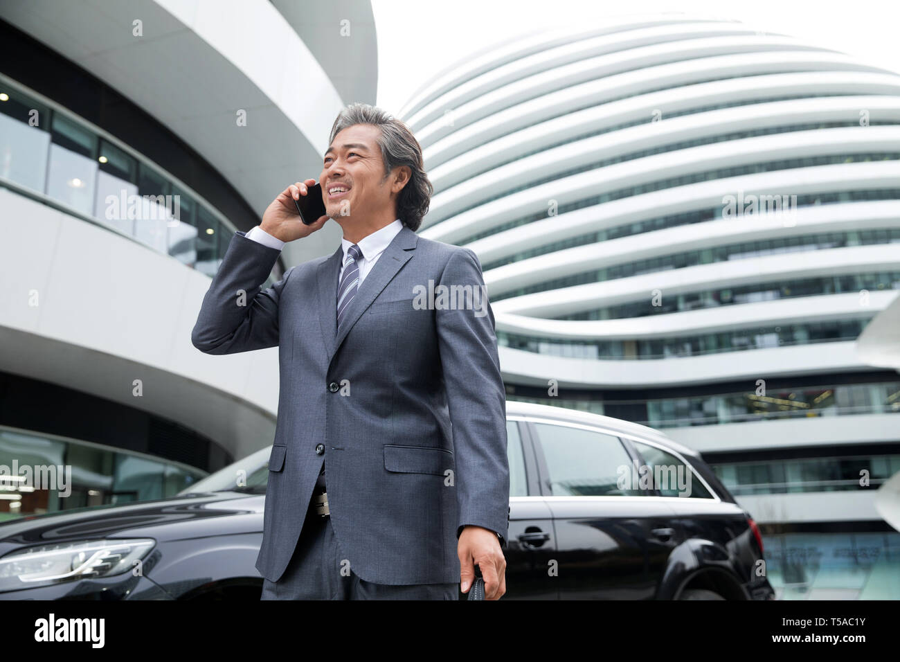 Business man make a phone call Stock Photo - Alamy