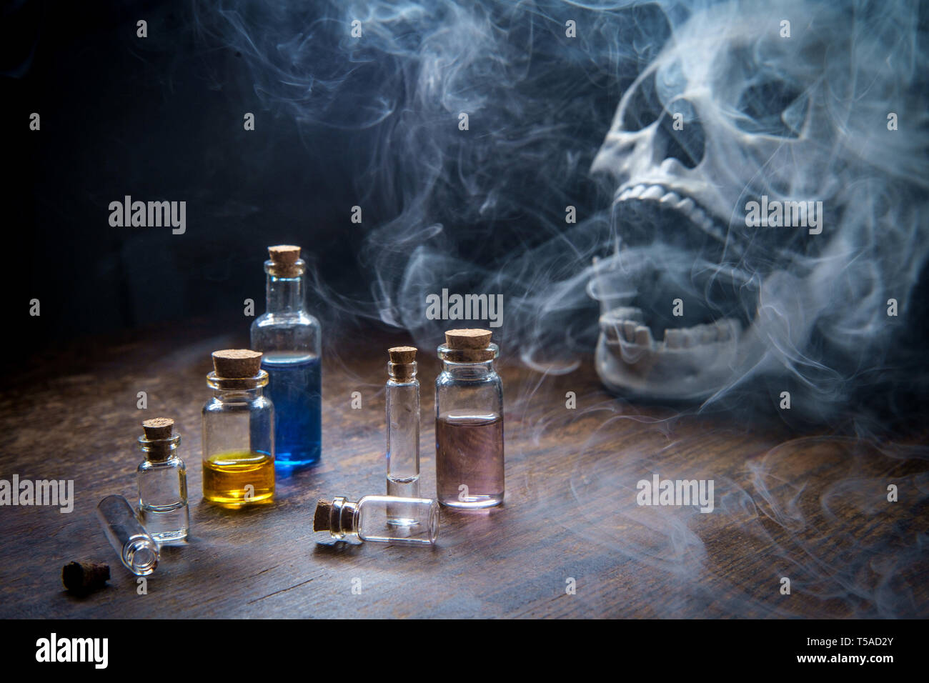 Witches magic potion poison bottles with vapors and human skull Stock ...
